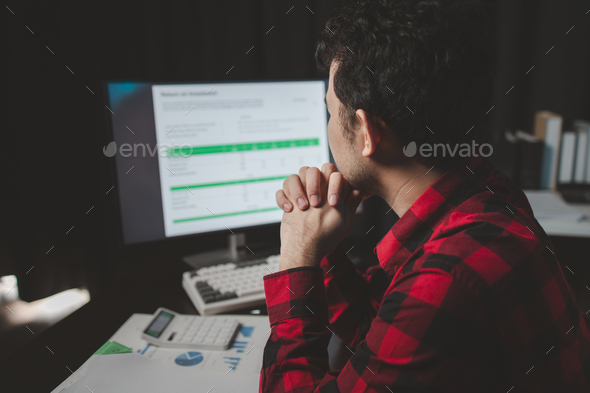 Startup company employees are working in the office overtime, overtime ...