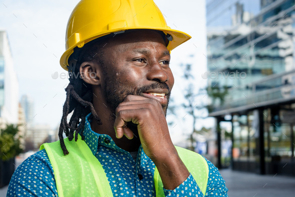 African ethnicity male construction chief engineer standing outdoors ...