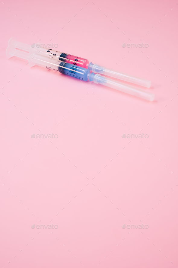 isolated sterilized injection syringe on a pink background Stock Photo ...