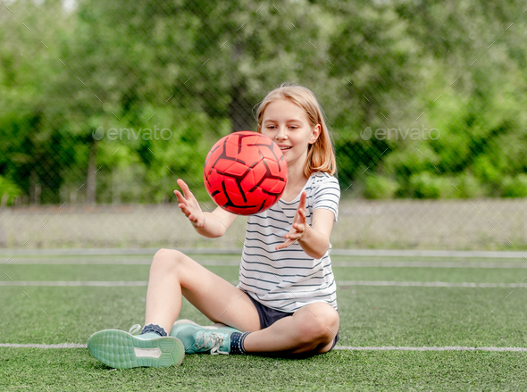 Pretty child girl with football ball Stock Photo by tan4ikk | PhotoDune