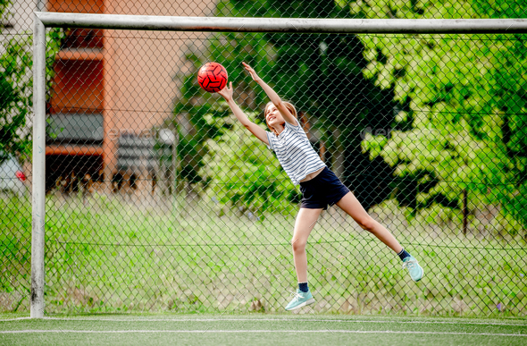 Pretty child girl with football ball Stock Photo by tan4ikk | PhotoDune