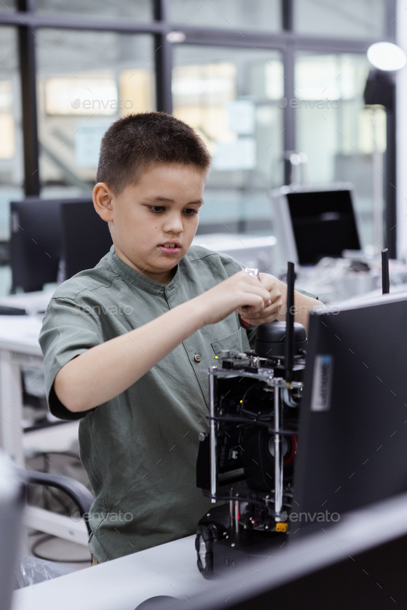 Boy in electronic class room. Kid boy education electronic AI class and ...