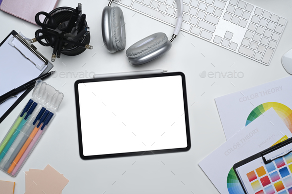 Graphic designer workspace with digital tablet, color palette, stationery and headphone. Stock ...