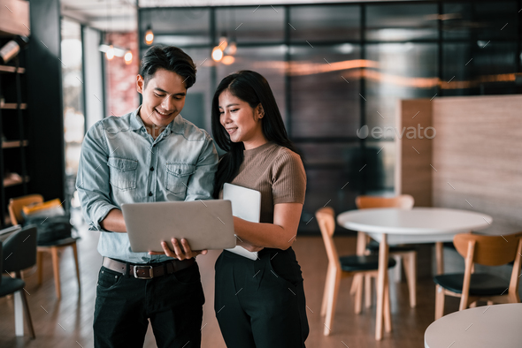 Post-class, students collaborate in tech-friendly, open library spaces, exchanging ideas ...