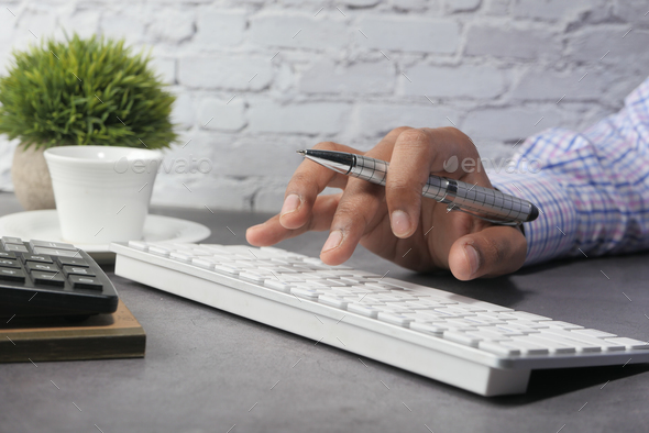 Hand using keyboard on office desk Stock Photo by towfiqu98 | PhotoDune