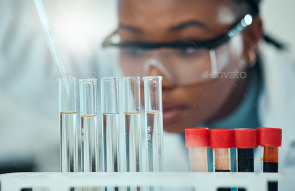 Science, blurred background and blood, woman with test tube in ...