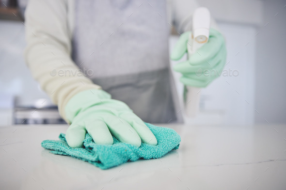 Person, hands and cleaning table with spray bottle in kitchen hygiene ...