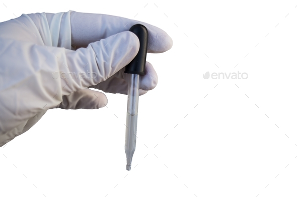Doctor hand holding a pipette on white background Stock Photo by wirestock