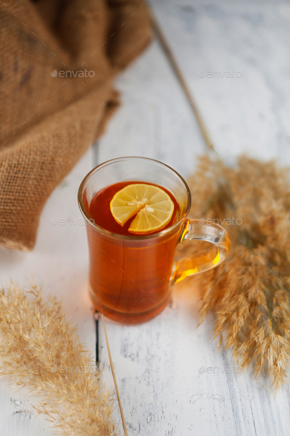 Closeup of a glass of hot tea on a white painted wooden surface Stock ...