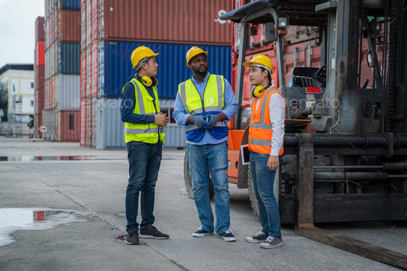 Worker check list of container cargo at container depot terminal. Stock ...