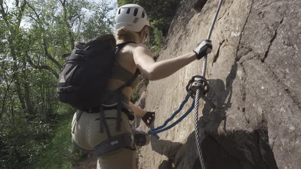 Rock Climber Attaching Rope To Guideline And Climbing Cliff, Stock Footage
