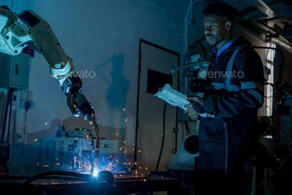 Engineer inspection control a robot arm welding machine with a remote ...