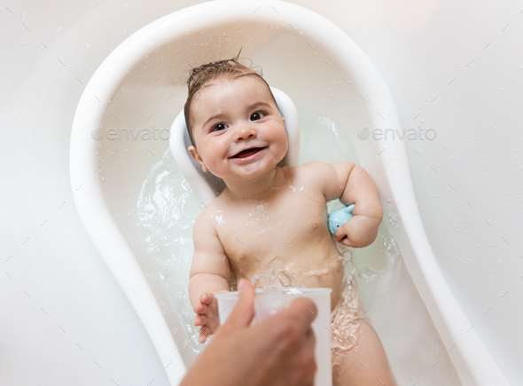 Happy bath time cute baby in bathtub Stock Photo by leszekglasner ...
