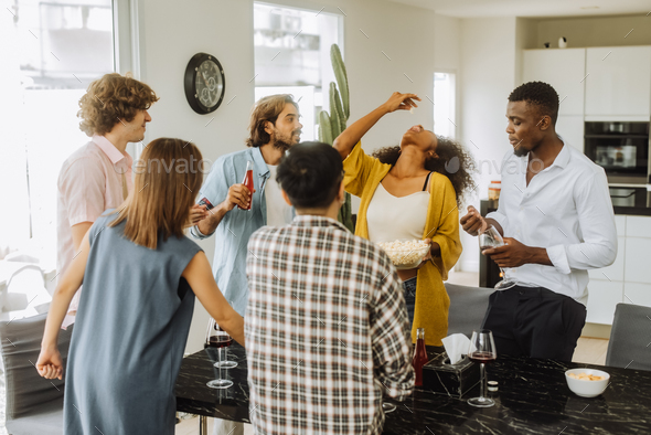 Lively, diverse friend reunion. Laughter, stories, bonding, music ...