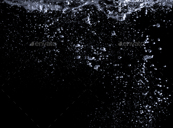 Blurry images of soda bubbles splashing in black background Stock Photo by gnepphoto