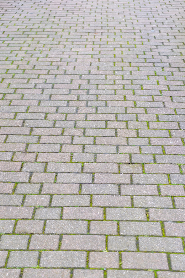 Stone paved floor background texture. Cobblestone grey footpath above ...