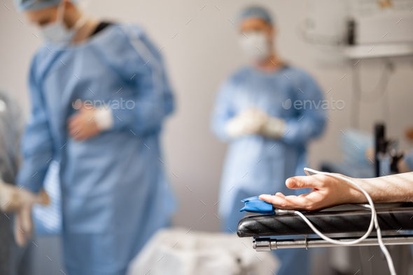 Patient's arm with a pulse oximeter in operating room Stock Photo by ...