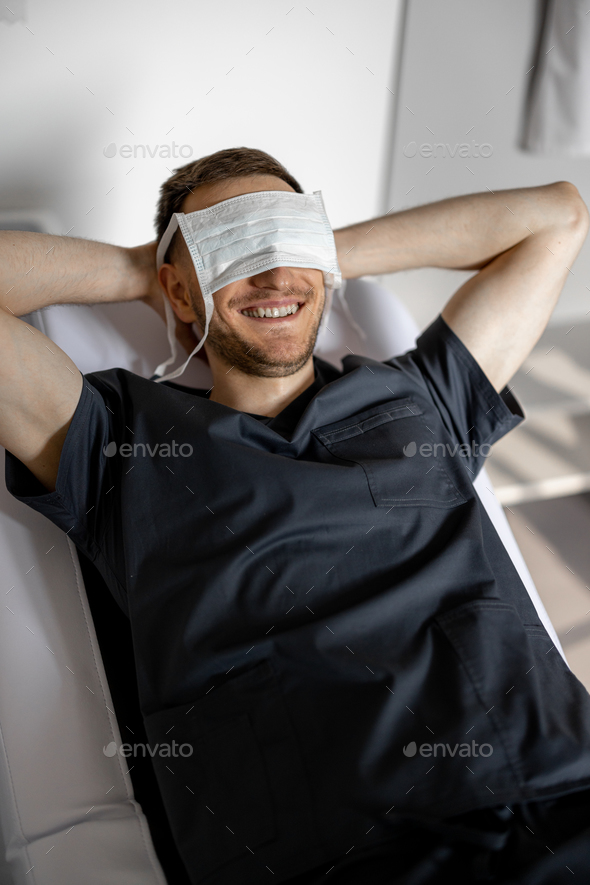 Surgeon rests after a hard work Stock Photo by RossHelen | PhotoDune