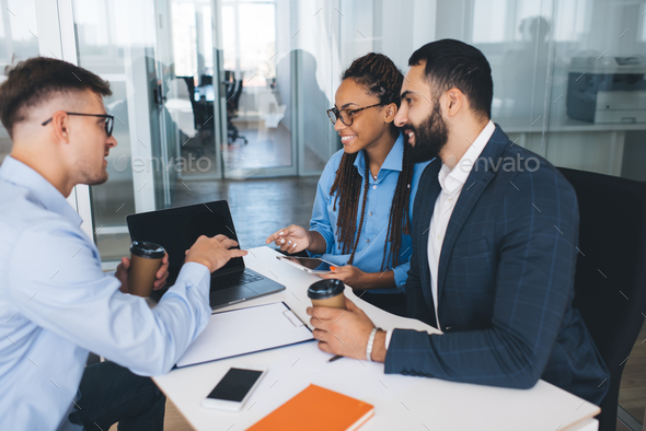 Group of professional partners talking about business strategy during ...