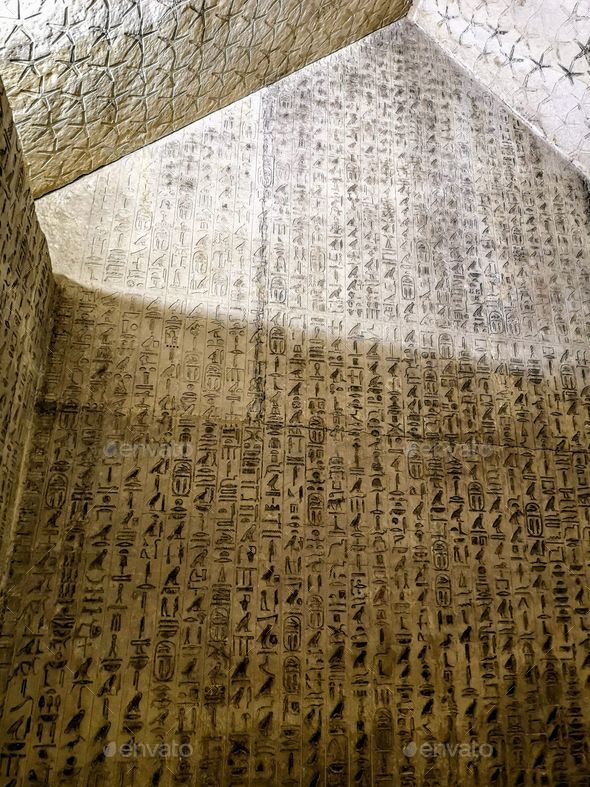 Vertical shot of the Pyramid Texts inscribed on the wall of a ...