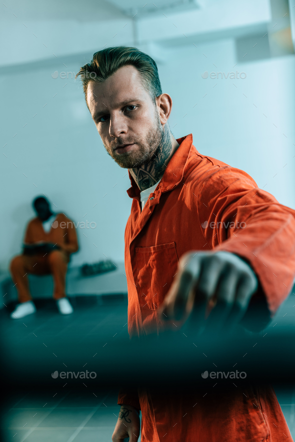 multiethnic prisoners in prison cell behind prison bars Stock Photo by ...