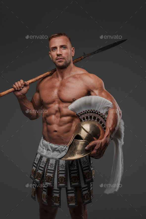 A muscular and attractive male model dressed in ancient pteruges Stock ...