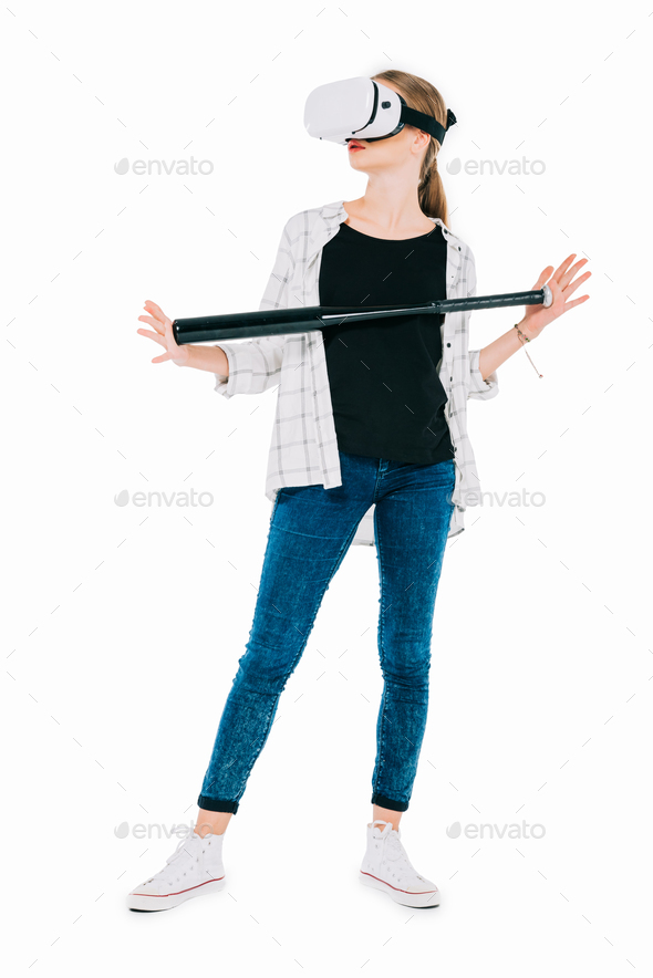 confident young woman in virtual reality headset holding baseball bat ...