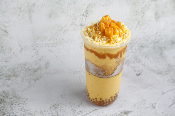 Cold beverage called Mango Graham Shake with assorted toppings Stock ...