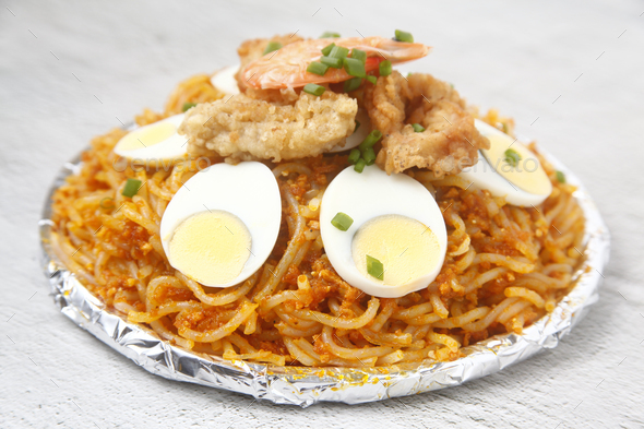 Freshly cooked Filipino food called Pancit Malabon Stock Photo by junpinzon