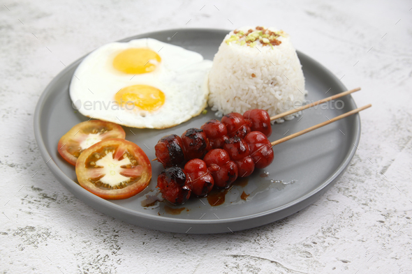 Freshly cooked Filipino food called Tocilog Stock Photo by junpinzon