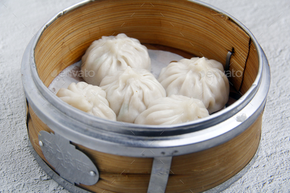 Freshly cooked Chinese food called Xiao Long Bao Stock Photo by junpinzon