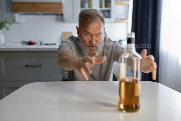 Portrait of senior man suffering from alcoholism Stock Photo by NomadSoul1