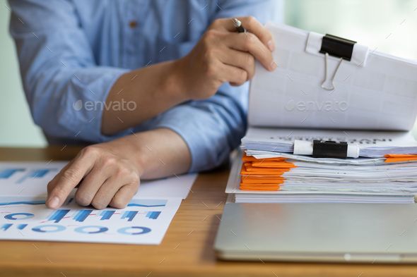 Business Documents, Auditor businessman checking working in stack of ...