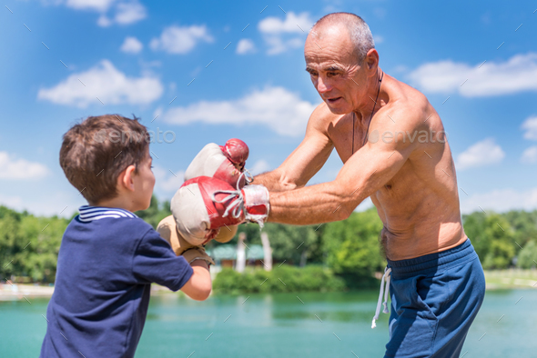 Small boxer with senior trainer Stock Photo by microgen | PhotoDune