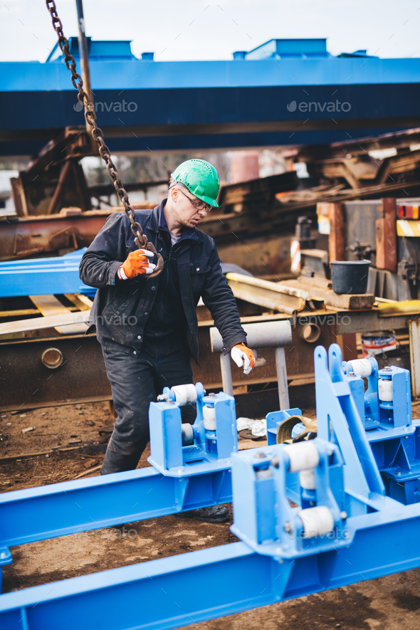 Manual worker working at shipyard construction site Stock Photo by ...