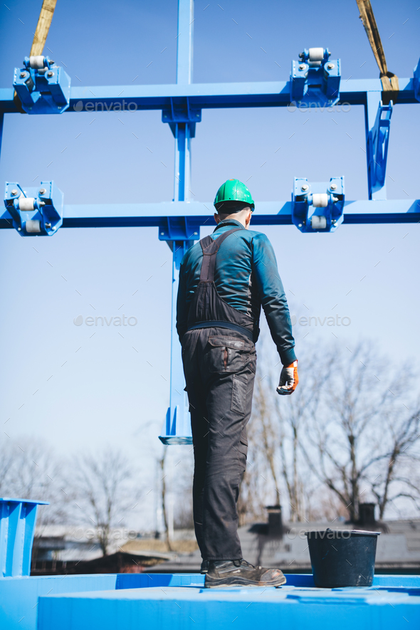 Manual worker working at shipyard construction site Stock Photo by ...