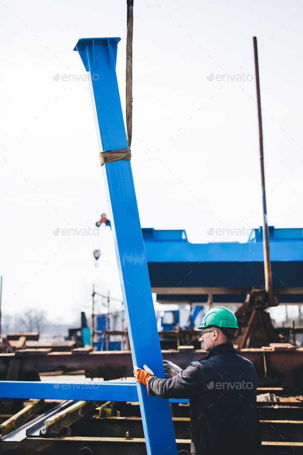 Manual worker working at shipyard construction site Stock Photo by ...