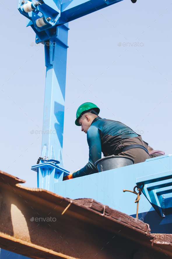 Manual worker working at shipyard construction site Stock Photo by ...