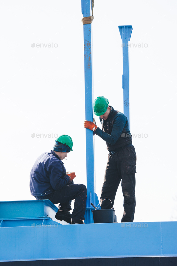 Manual worker working at shipyard construction site Stock Photo by ...