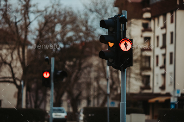Traffic light burning red for pedestrians Stock Photo by wirestock