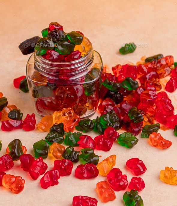 Vertical closeup of sugared soft gummies with the shape of panda bears ...