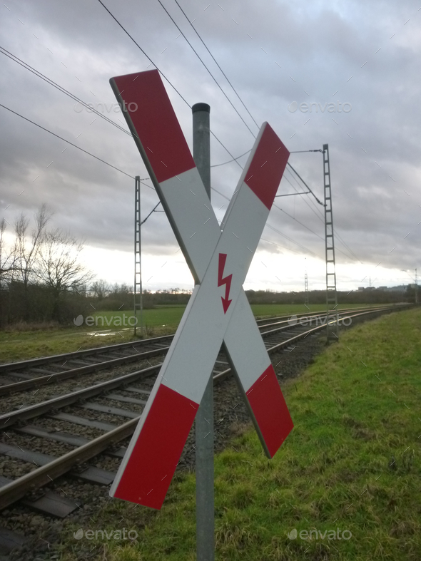 Signs of a railway crossing in northern Frankfurt Stock Photo by wirestock