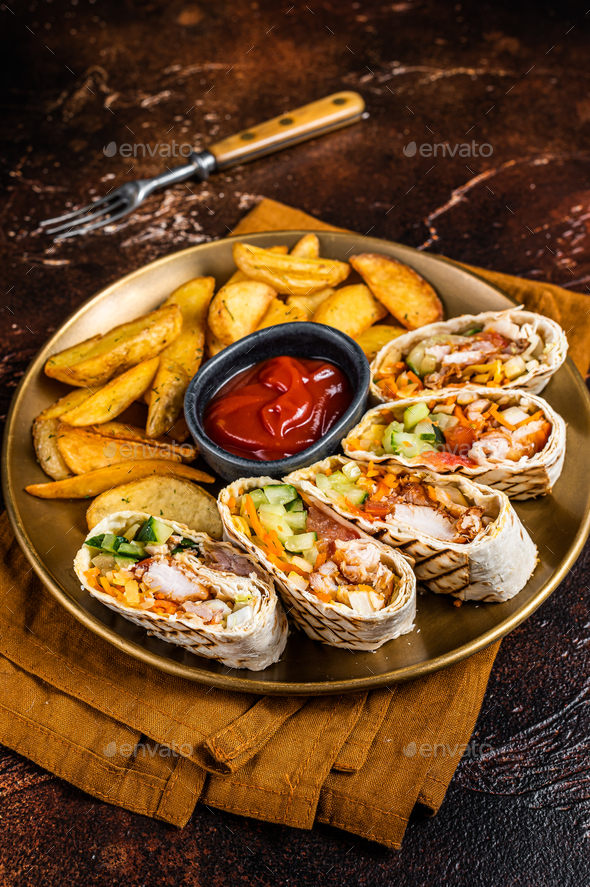 Chicken shawarma durum doner kebab with vegetable salad and french ...