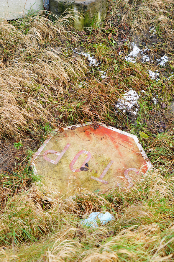 Vertical shot of an old damaged stop sign in the grass Stock Photo by ...