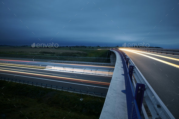 Road overpass over multiple lane highway in countryside Stock Photo by ...