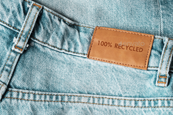 Jeans labeled 100% recycled. Sustainable fashion, conscious consumption ...