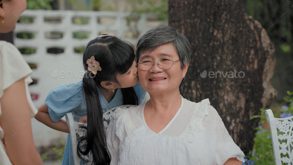 Granddaughter or child kissing grandma cheek Stock Photo by JR-50 ...