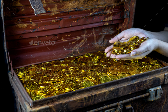 Lots of stacking Gold Coin in lady hand and treasure chest Stock Photo ...