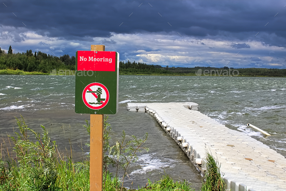 A red no mooring sign beside a floating dock during a storm Stock Photo ...