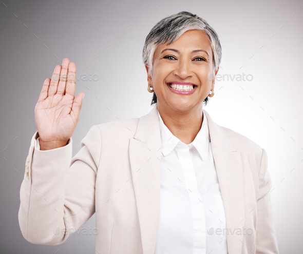 Smile, wave and portrait of a woman on a studio background for hello ...